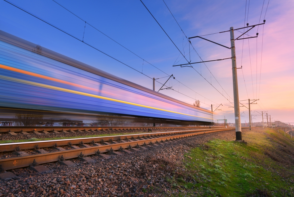 High Speed Blue Passenger Train In Motion - Emerging Europe